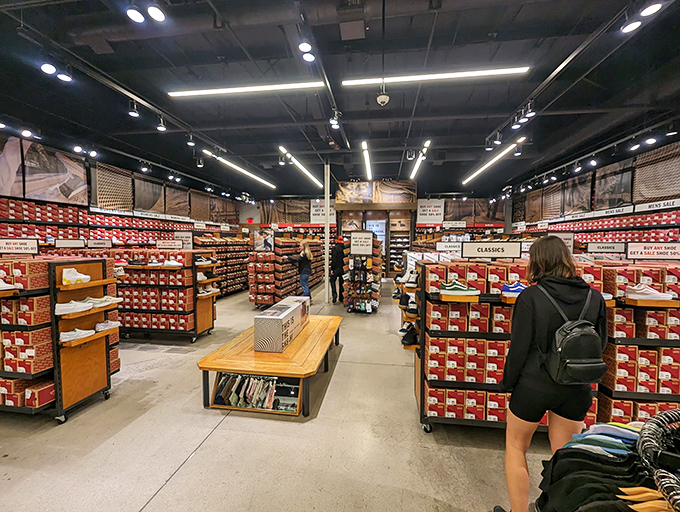 Sneaker heaven awaits at the Vans store, where walls of footwear create a colorful mosaic that would make any skateboarder's heart race.