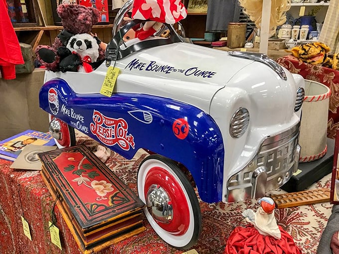 A pristine Pepsi-Cola pedal car that would make any soda fountain owner green with envy.