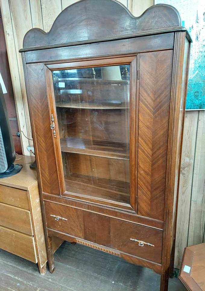 Vintage display cabinets like this once graced formal dining rooms where Sunday dinners were sacred family rituals.