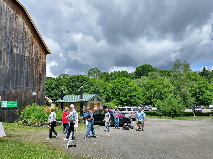 The historic barn serves as visitor headquarters, where nature enthusiasts gather before dispersing into the wilderness like woodland elves on a mission.