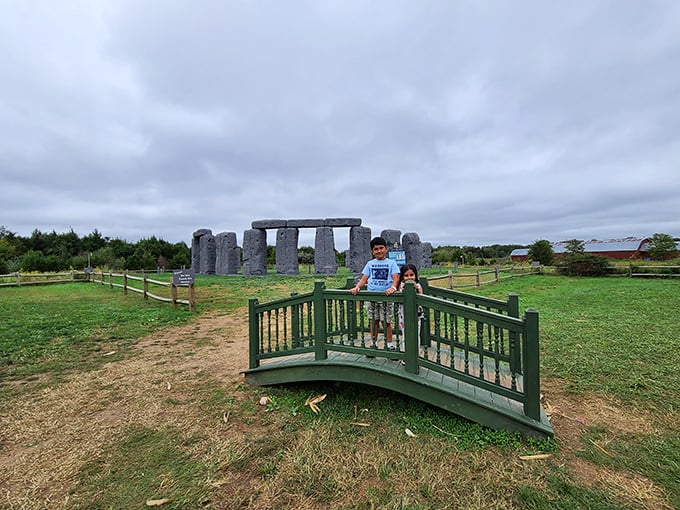 Crossing the charming footbridge to Foamhenge feels like stepping into a storybook where history and whimsy collide.