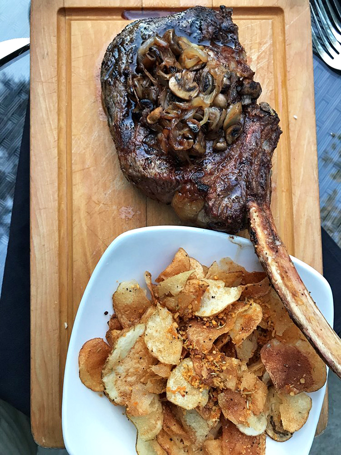 This bone-in masterpiece topped with caramelized mushrooms isn't just dinner&mdash;it's a primal experience that would make Fred Flintstone weep with joy.