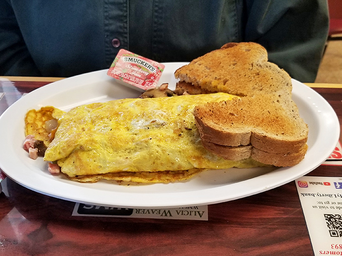This Western Omelet doesn't need fancy plating to impress&mdash;just perfectly cooked eggs stuffed with ham and veggies alongside golden toast. Breakfast nirvana achieved!