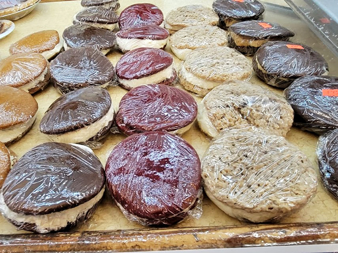 Whoopie pies lined up like edible hockey pucks of joy. The chocolate-to-cream ratio here is what mathematicians call "the golden delicious ratio."