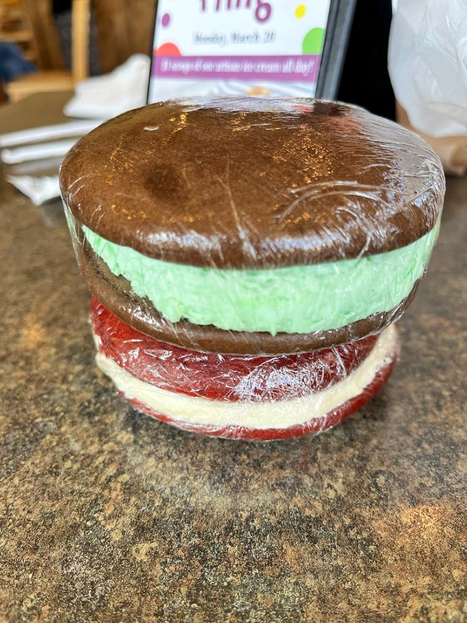 Behold the Neapolitan of whoopie pies—chocolate, mint, and red velvet layers stacked like a dessert skyscraper that would make any architect jealous.