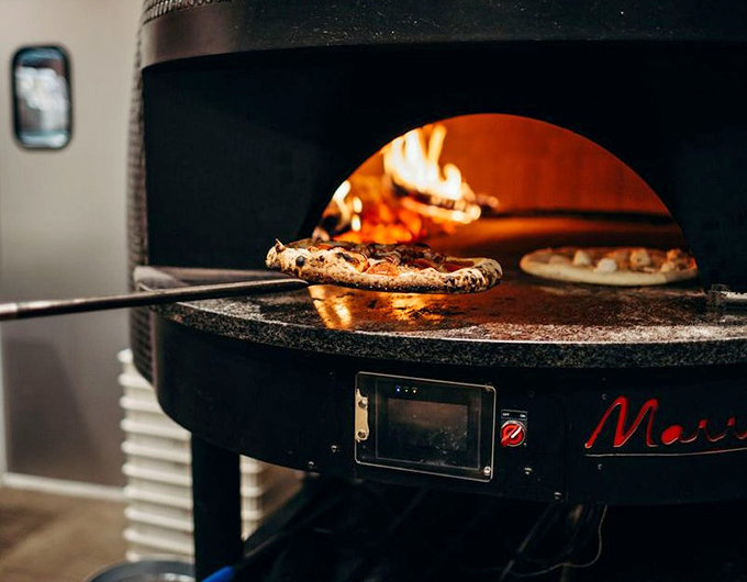 Where pizza dreams are born&mdash;watching dough transform in the fiery belly of a wood-fired oven is dinner theater at its finest.