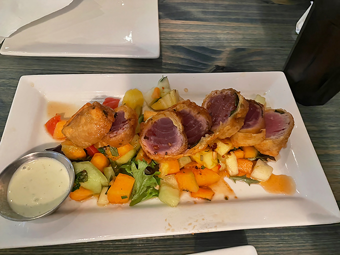 Yellowfin tuna tataki that's seared to perfection, proving sometimes the simplest preparations are the most sublime.