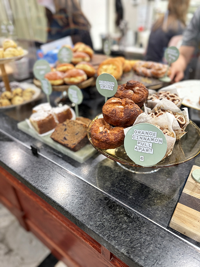A pastry case that makes diets spontaneously combust. That orange cinnamon pull-apart is basically Ohio's answer to the siren song.
