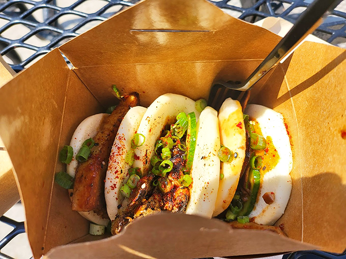 Behold the bao bun that launched a thousand road trips! Pillowy soft exterior cradles perfectly seasoned meat, topped with fresh scallions and a sauce worth bottling.