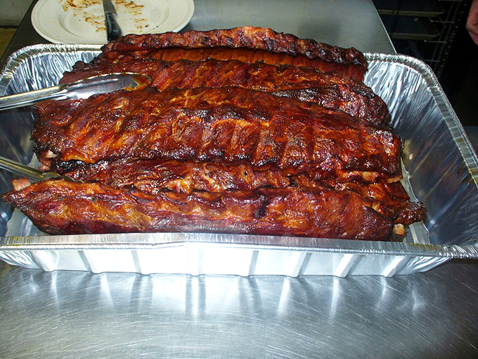 These ribs aren't just cooked, they're transformed &ndash; that glaze catching light like stained glass windows in a cathedral of smoke.