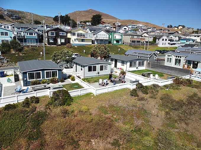 A neighborhood where white picket fences frame million-dollar views, and nobody's rushing to check their email or stock portfolio.