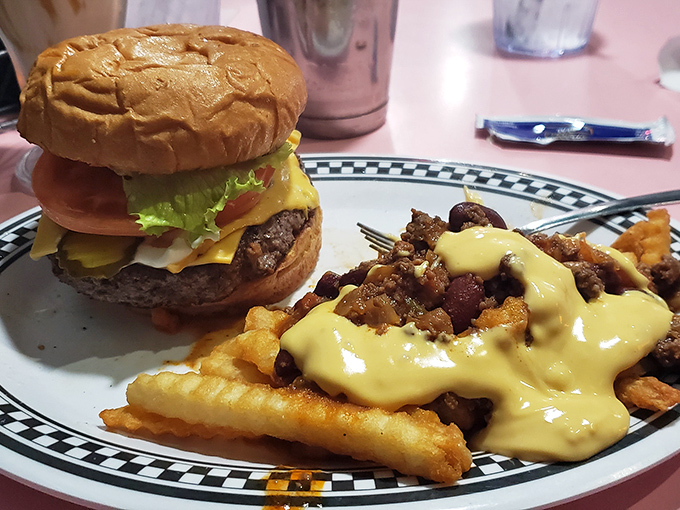 Cheeseburger paradise meets loaded fries nirvana. The plate practically hums "Stairway to Heaven" as you contemplate where to dive in first.