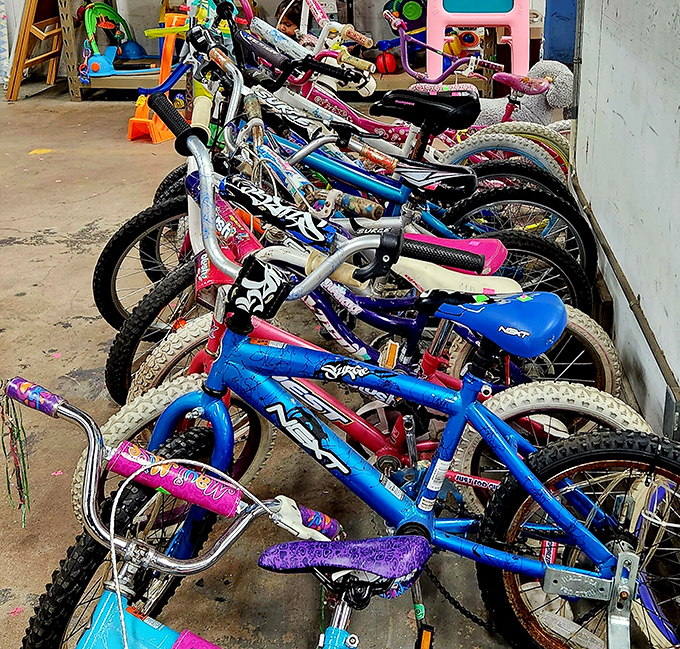Bicycle bonanza! Kids' dreams on wheels line up like colorful soldiers, waiting for second chances and new adventures.
