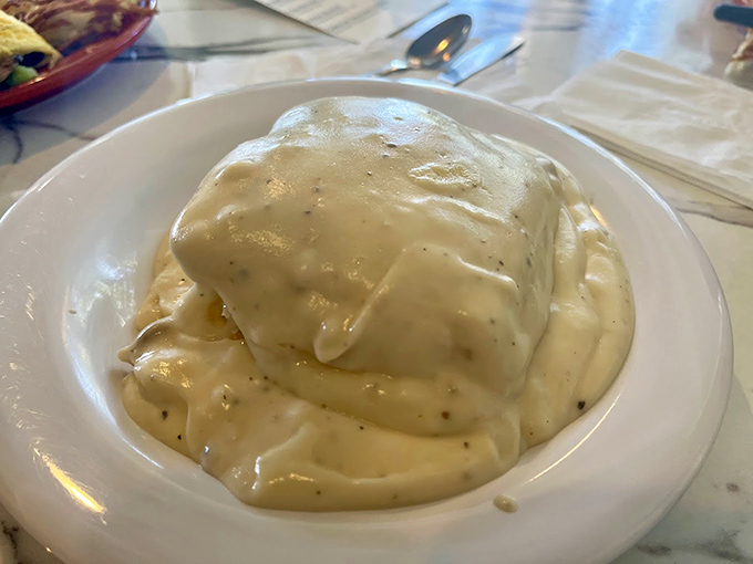 Behold the mountain of gravy-covered glory that turns grown adults into happy, speechless children at first bite.