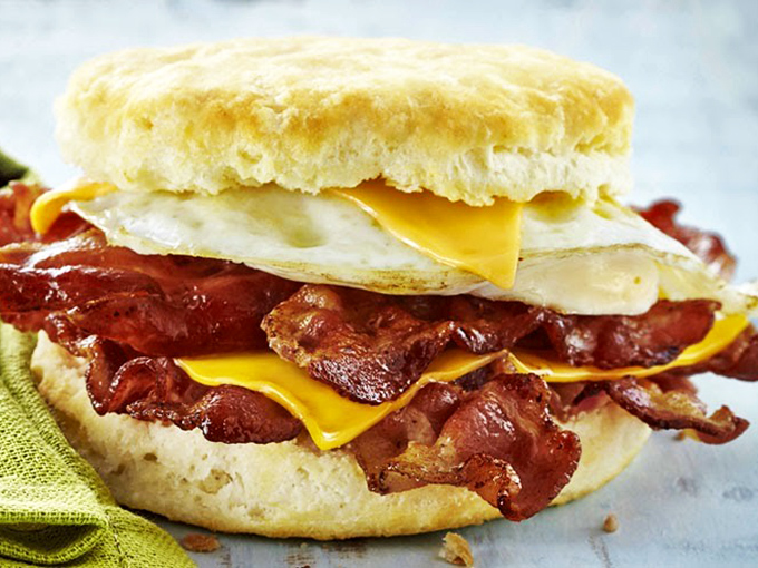 This drive-thru menu showcases the "Ultimate Lineup" of biscuit sandwiches alongside housemade dipping sauces that would indeed make ketchup jealous.