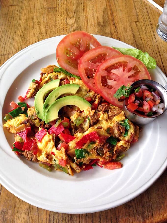 This isn't just a scramble&mdash;it's a colorful fiesta on a plate. Fresh avocado, pico de gallo, and eggs harmonizing like a perfectly calibrated breakfast symphony.