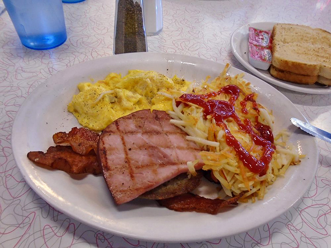This breakfast plate proves that mornings were meant for bacon, eggs, and zero regrets about portion sizes.