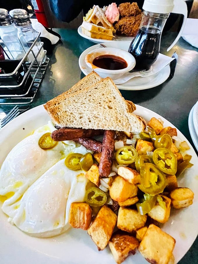 Eggs, potatoes, jalape&ntilde;os, and toast&mdash;a breakfast symphony where every instrument plays in perfect harmony. The crispy potatoes deserve their own fan club.