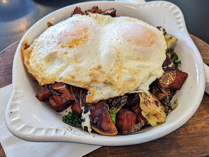 Breakfast nirvana achieved! Perfectly cooked eggs crown a colorful medley of roasted vegetables and potatoes in this hearty breakfast bowl.