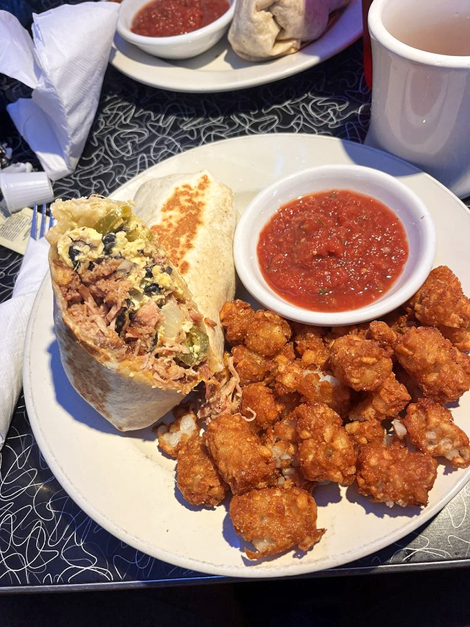 Breakfast burritos that could fuel a spacewalk, paired with crispy tater tots and homemade salsa. Houston, we have no problems here.