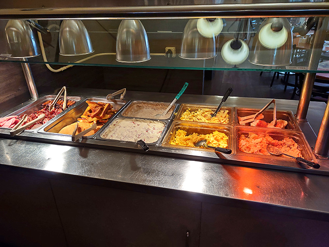 Breakfast nirvana awaits at the buffet line, where scrambled eggs, bacon, and all your morning favorites stand at attention, ready for duty.