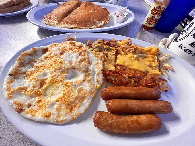 Breakfast perfection doesn't need to be complicated&mdash;just eggs cooked exactly right, sausage links with snap, and hash browns that mean business.