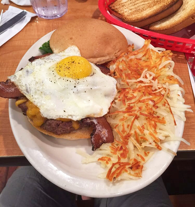 Breakfast architecture at its finest&mdash;a tower of burger, bacon, and sunny-side-up egg that makes your avocado toast look like amateur hour.