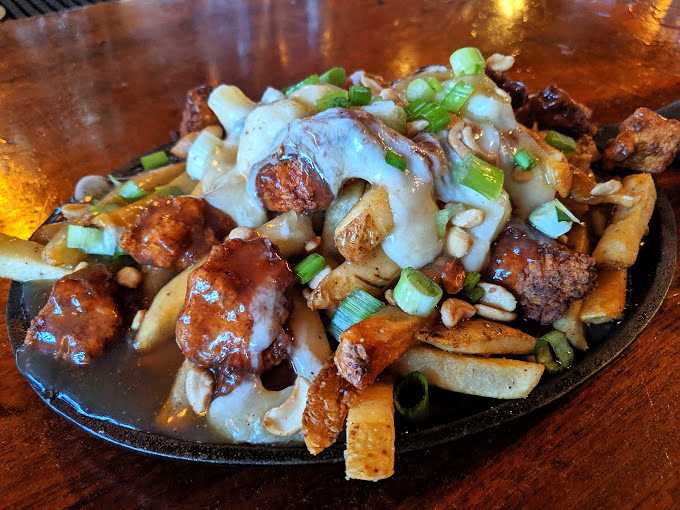 Not your Canadian grandmother's poutine! This breakfast version with crispy fries, savory gravy, and green onions might just be worth moving to Missouri for.