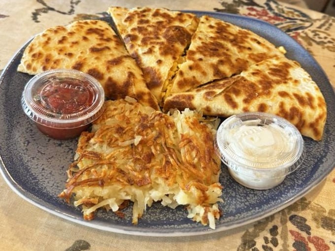 Behold the legendary breakfast quesadilla in its golden-brown glory. That crispy hash brown side is the unsung hero of this plate.