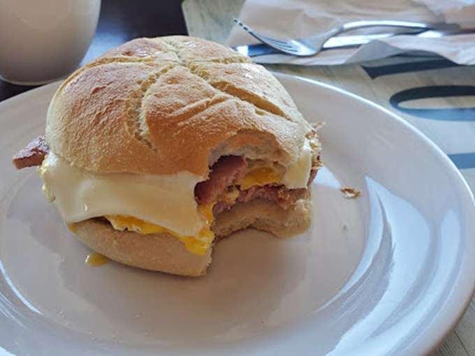 This breakfast sandwich isn't just breaking fast—it's breaking records for the perfect ratio of crusty bread, melty cheese, and savory fillings.