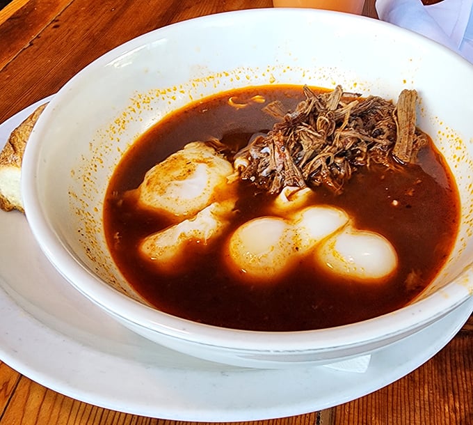 Behold the legendary brisket breakfast! Tender, slow-roasted beef swimming in rich broth alongside perfectly poached eggs. Breakfast nirvana exists, and it's right here.