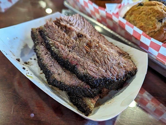 Brisket with a bark so perfect it deserves its own standing ovation. That smoke ring isn't just for show&mdash;it's a pink badge of low-and-slow honor.
