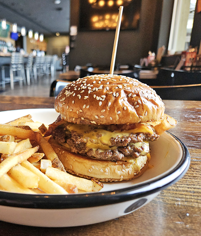 Behold the burger that launches a thousand road trips. That melty cheese cascade isn't just delicious &ndash; it's practically performance art.