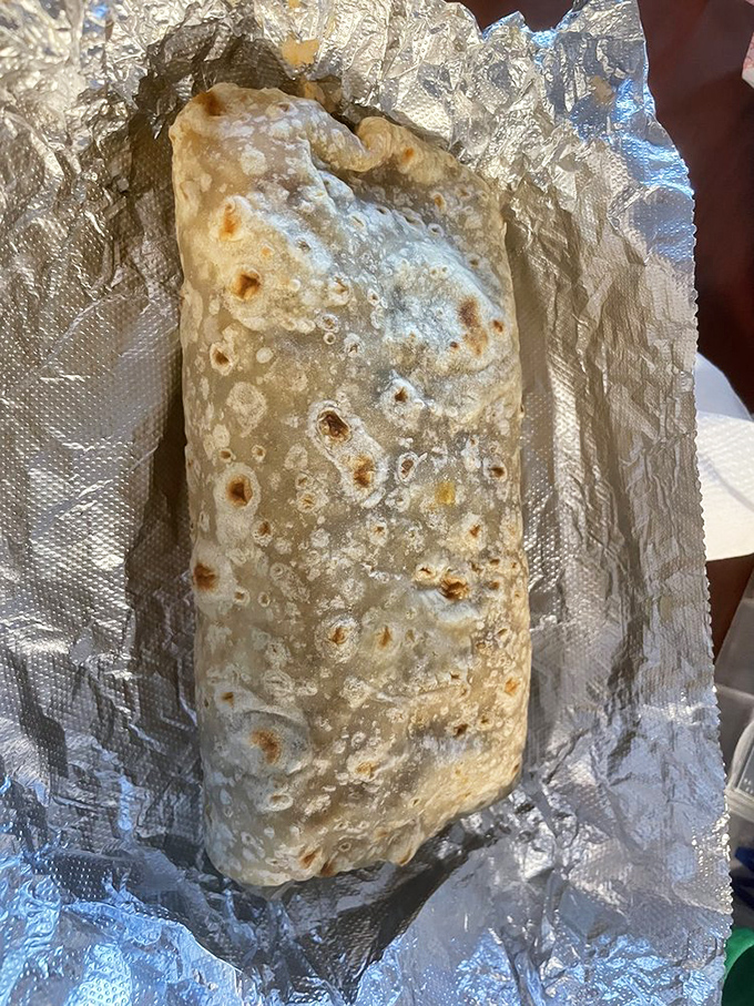 Behold the burrito in its natural habitat: perfectly grilled tortilla, substantial heft, and wrapped with the care usually reserved for newborn babies.