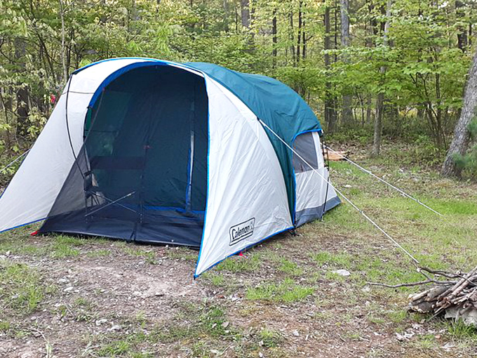 Home sweet temporary home. This tent isn't just shelter; it's your ticket to falling asleep counting actual stars instead of reviewing spreadsheets. 