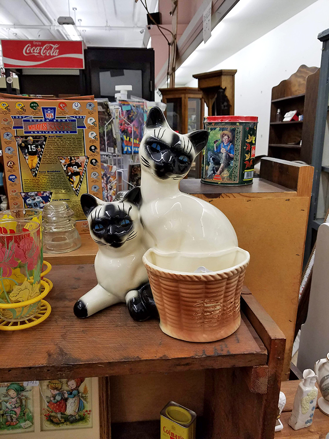 These ceramic felines aren't just kitsch; they're the kind of quirky find that follows you home and becomes a family joke-turned-heirloom.