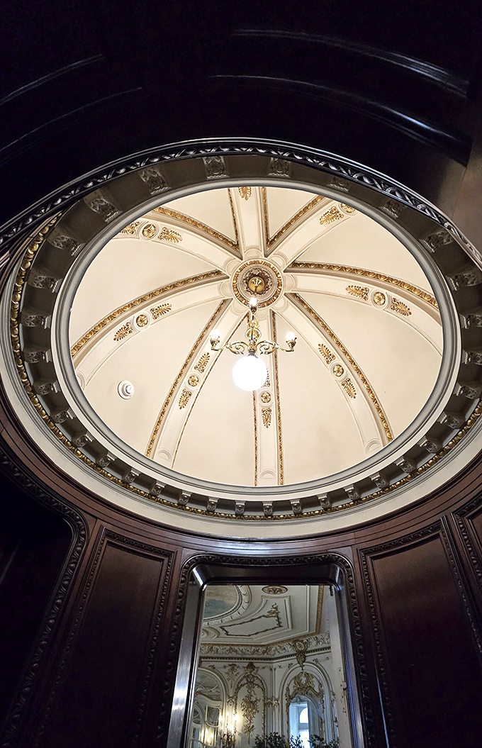 Look up! The castle's magnificent domed ceiling transforms a simple room into a Renaissance masterpiece. Michelangelo would have approved of this heavenly view.