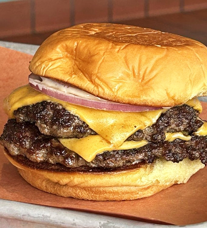 The cheeseburger that launched a thousand cravings. Two patties, melted American cheese, and a perfectly toasted bun&mdash;proof that simplicity, when done right, is revolutionary.