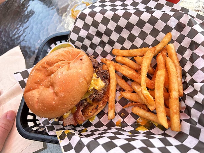 Behold the humble cheeseburger, elevated to art form. That melty cheese cascade is nature's way of saying "diet tomorrow."
