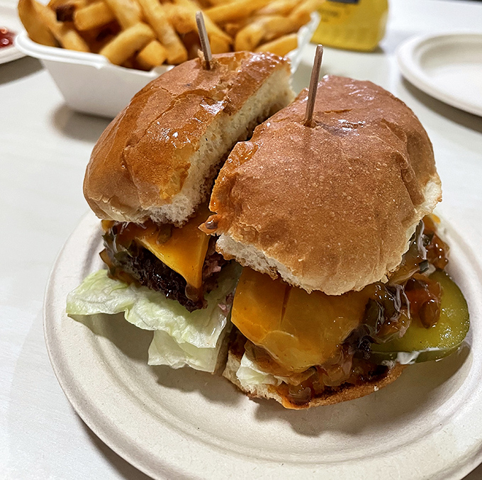 The legendary Hickoryburger arrives like a delicious architectural achievement—melted cheese cascading down the patty, the special sauce making a compelling case for simplicity.