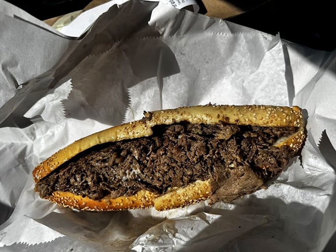 This isn't just a sandwich, it's a masterpiece of meat and cheese engineering wrapped in paper like precious cargo.