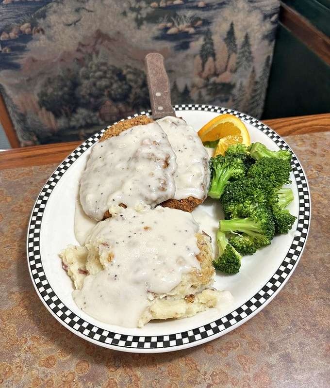 Country fried steak nirvana: golden-crisp exterior giving way to tender beef, all swimming in creamy pepper gravy that should be classified as a controlled substance.