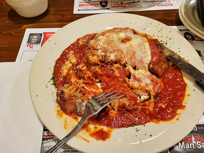 This chicken parmigiana isn't just dinner&mdash;it's edible architecture: layers of crispy breading, tender chicken, and molten cheese swimming in a sea of vibrant marinara.