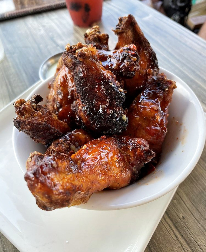 These wings aren't just crispy, they're having an out-of-body experience in sauce heaven. Napkins required, regrets impossible.