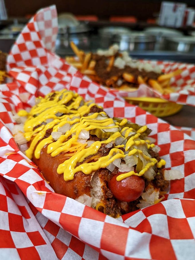 This isn't a chili dog for the faint of heart. It's a glorious mess of beef, mustard, and onions that requires strategy, napkins, and zero shame.