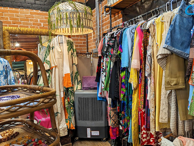 The clothing section bursts with color like your eccentric aunt's closet&mdash;each piece telling stories of decades past while promising new adventures ahead.