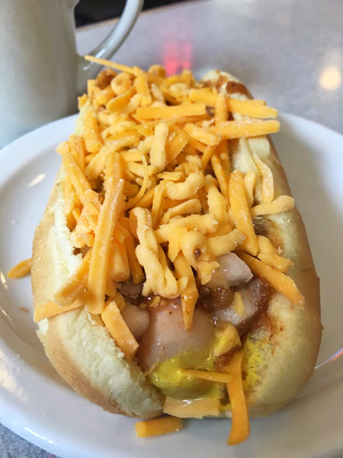The loaded coney in all its glory &ndash; a perfect ratio of meat sauce to mustard to onions to cheese, engineering at its most delicious.