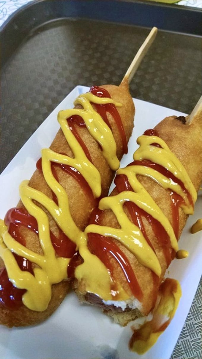 These golden-battered beauties aren't just corn dogs &ndash; they're edible time machines, transporting you back to when food on a stick was revolutionary.