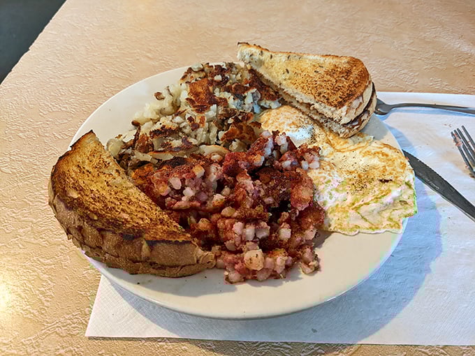 Corned beef hash nirvana &ndash; crispy edges, tender centers, perfectly fried eggs, and toast that's actually worthy of the name. Breakfast of champions, indeed.