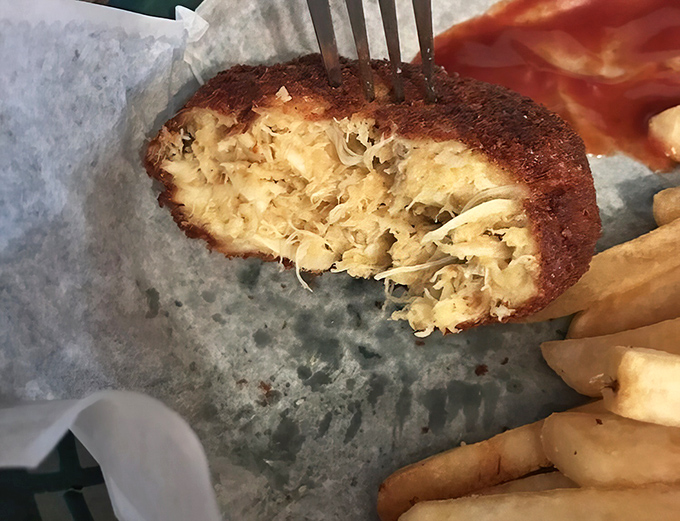 Behold the holy grail of crab cakes—more delicious lump meat than binding, with a golden crust that should be enshrined in the Seafood Hall of Fame.